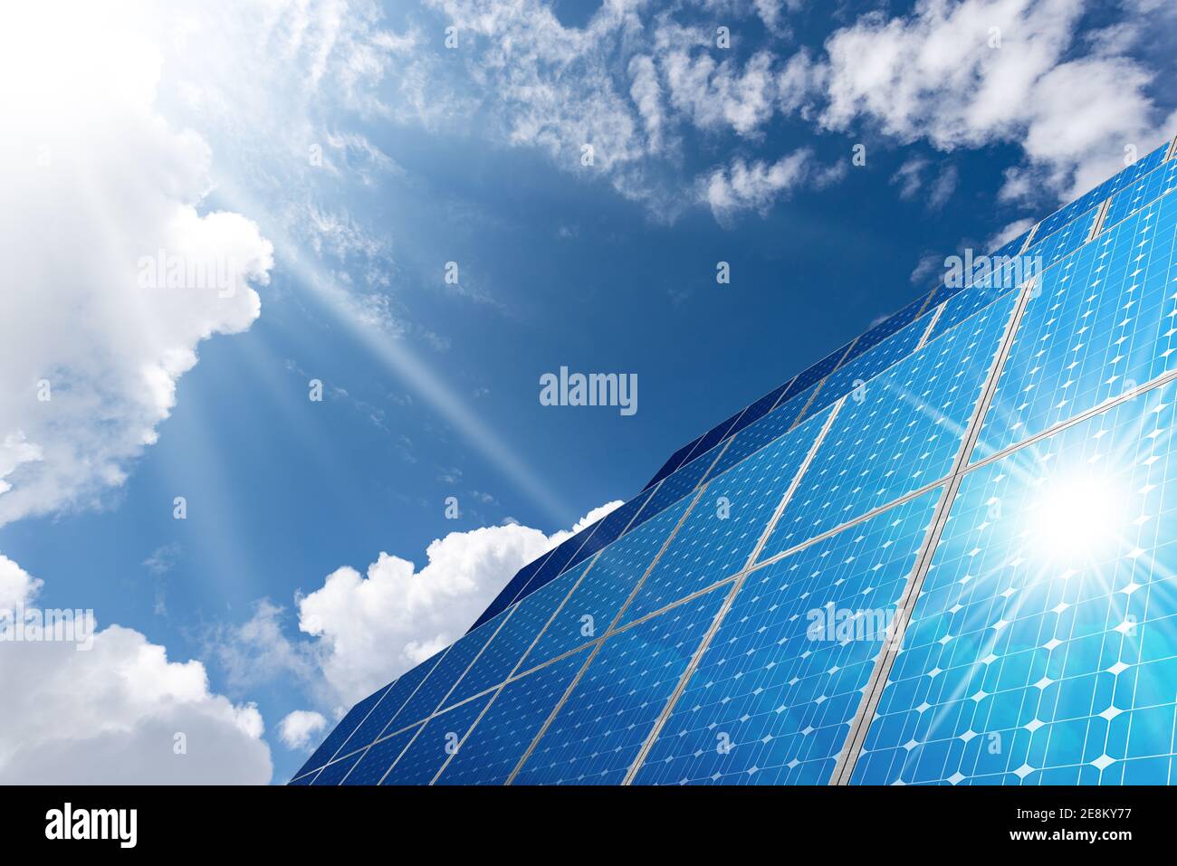 Large group of solar panels on blue sky with clouds and sun rays. Solar ...