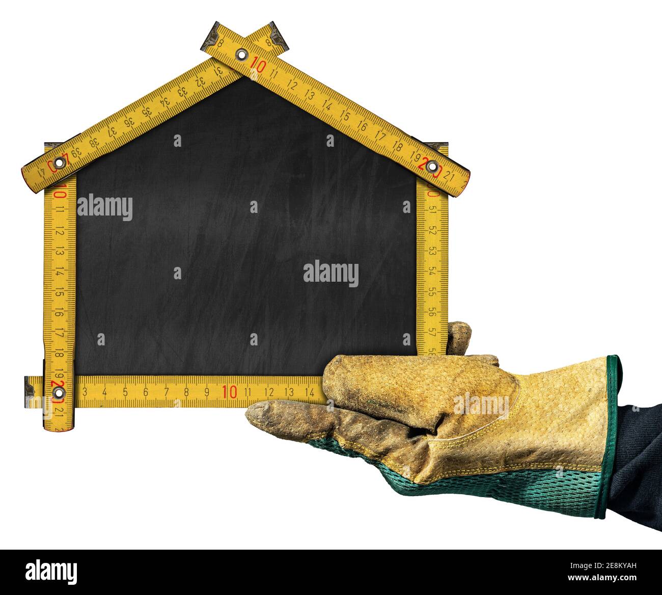 Gloved hand holding a folding ruler in the shape of a house with empty ...