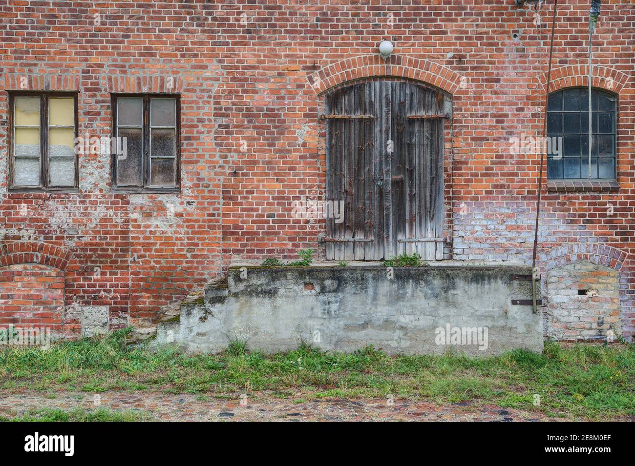 Loading ramp at an old, abandoned cowshed, witness of a bygone era when ...