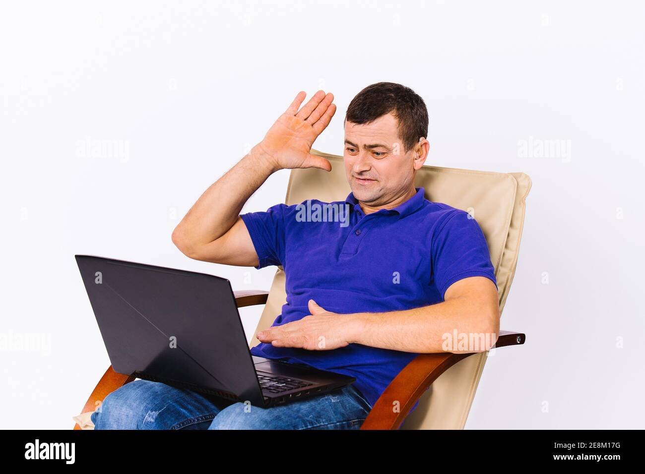 Caucasian man online via video communication using gestures. Raised his ...