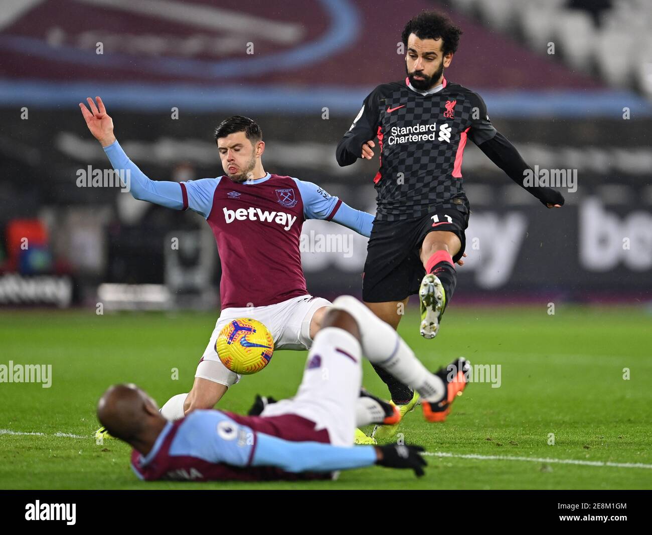 Liverpool's Mohamed Salah (right) attempts a shot on goal during the ...