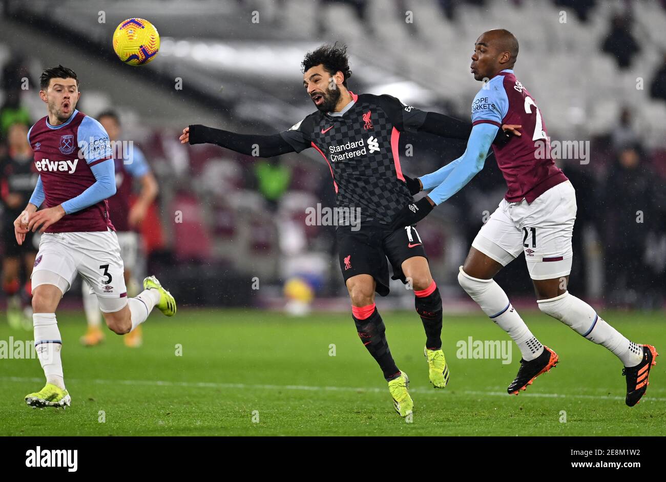 Liverpool's Mohamed Salah (centre) attempts a shot on goal during the ...