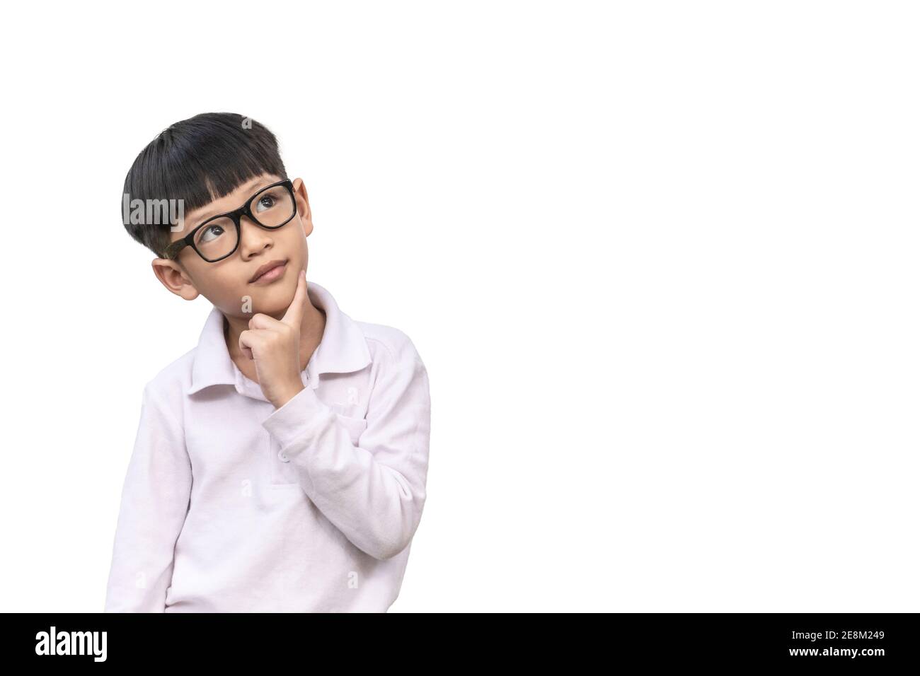 A child wearing glasses looks smart-looking up in doubt isolated on ...