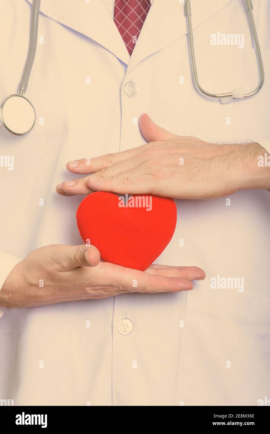 Doctor hands heart hi-res stock photography and images - Alamy