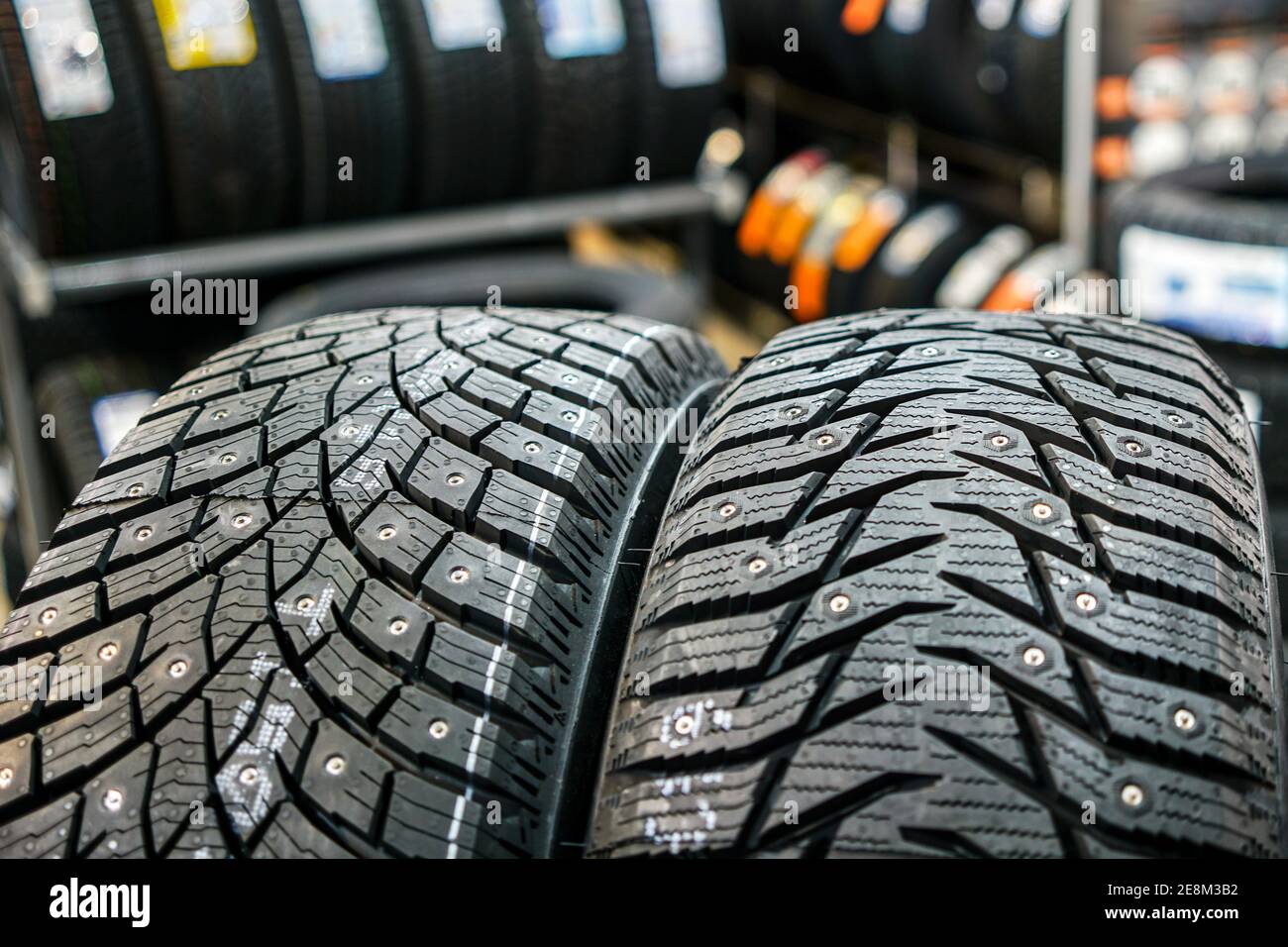 closeup view of two studded winter tires with different treads Stock ...