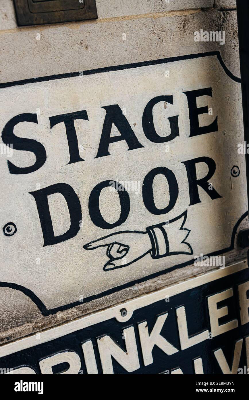 Hand-painted 'Stage Door' sign with left pointing hand in the West End ...