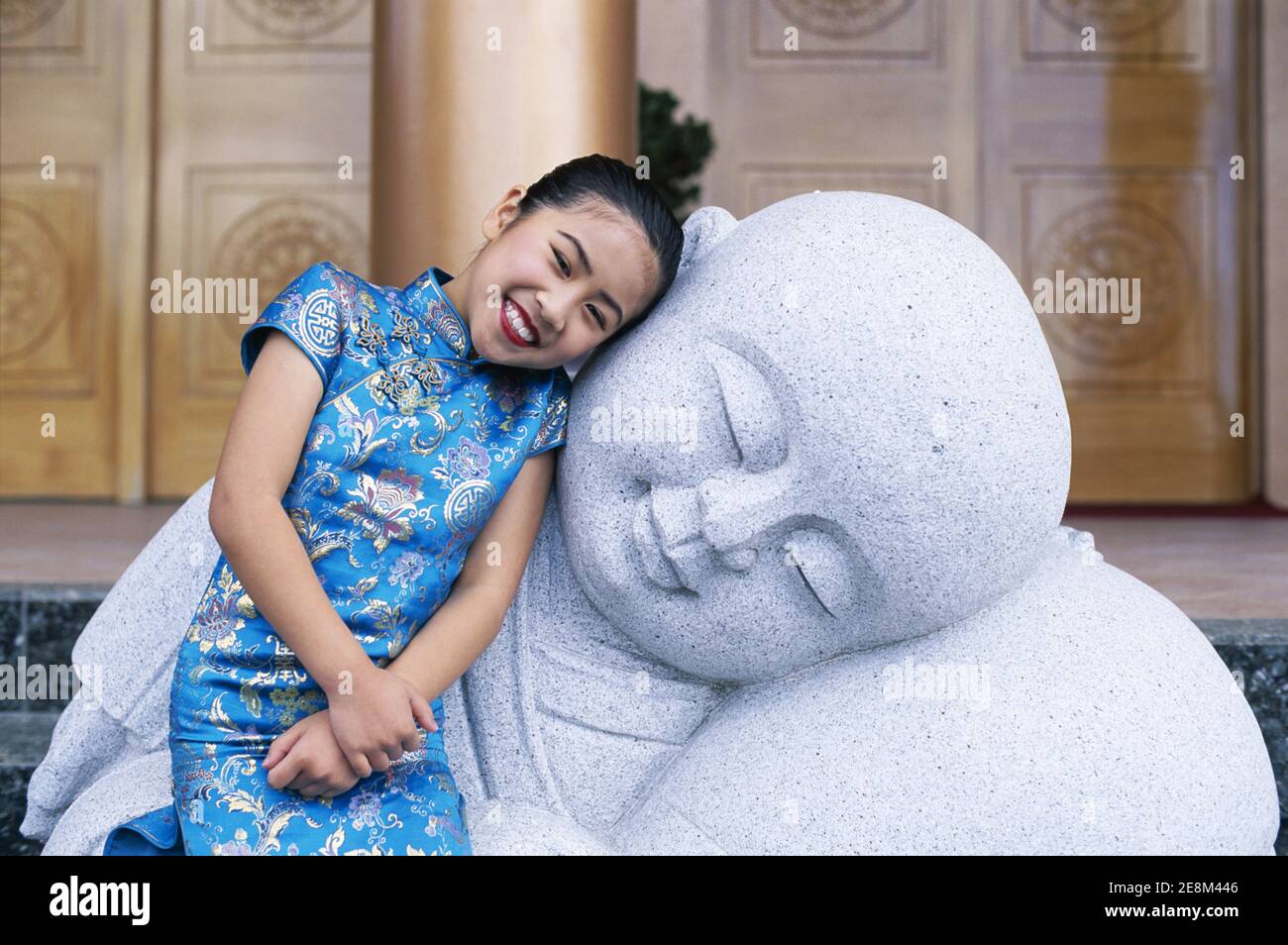 Asia, China, Beijing, cute smiling child dressed in traditional ...