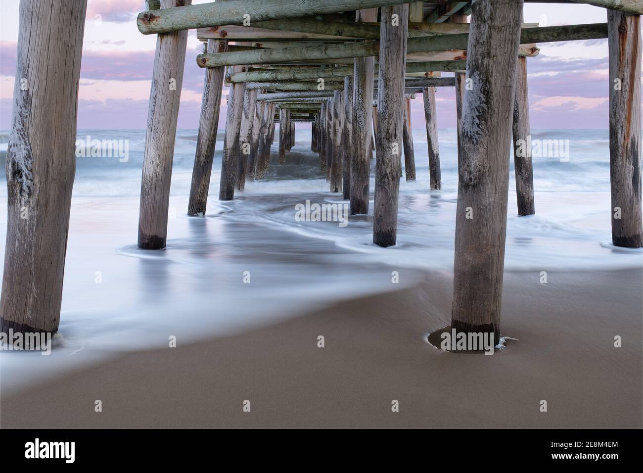 The Sandbridge Fishing Pier in Virginia Beach at sunset, with long ...