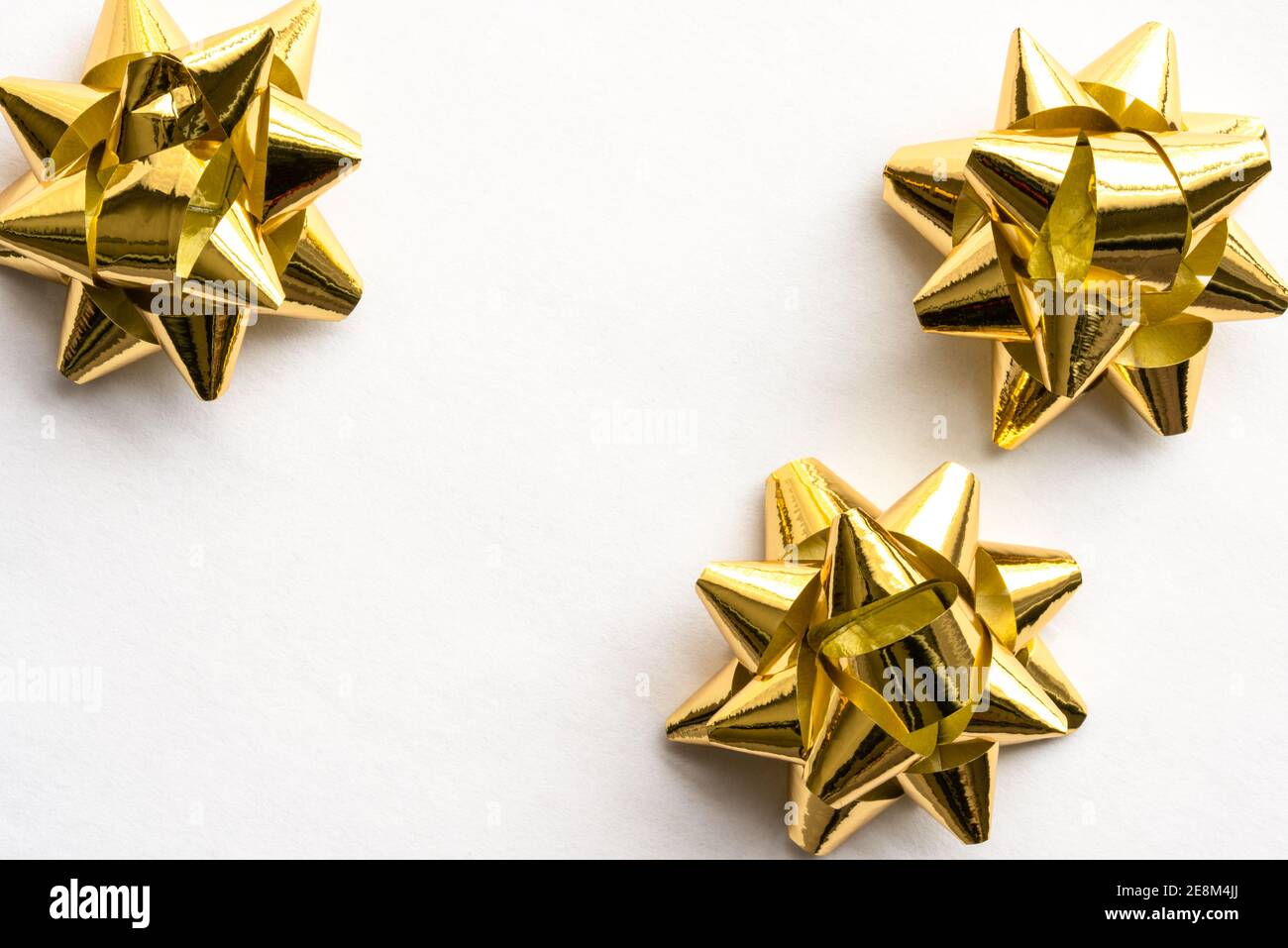 Gold bows hi-res stock photography and images - Alamy