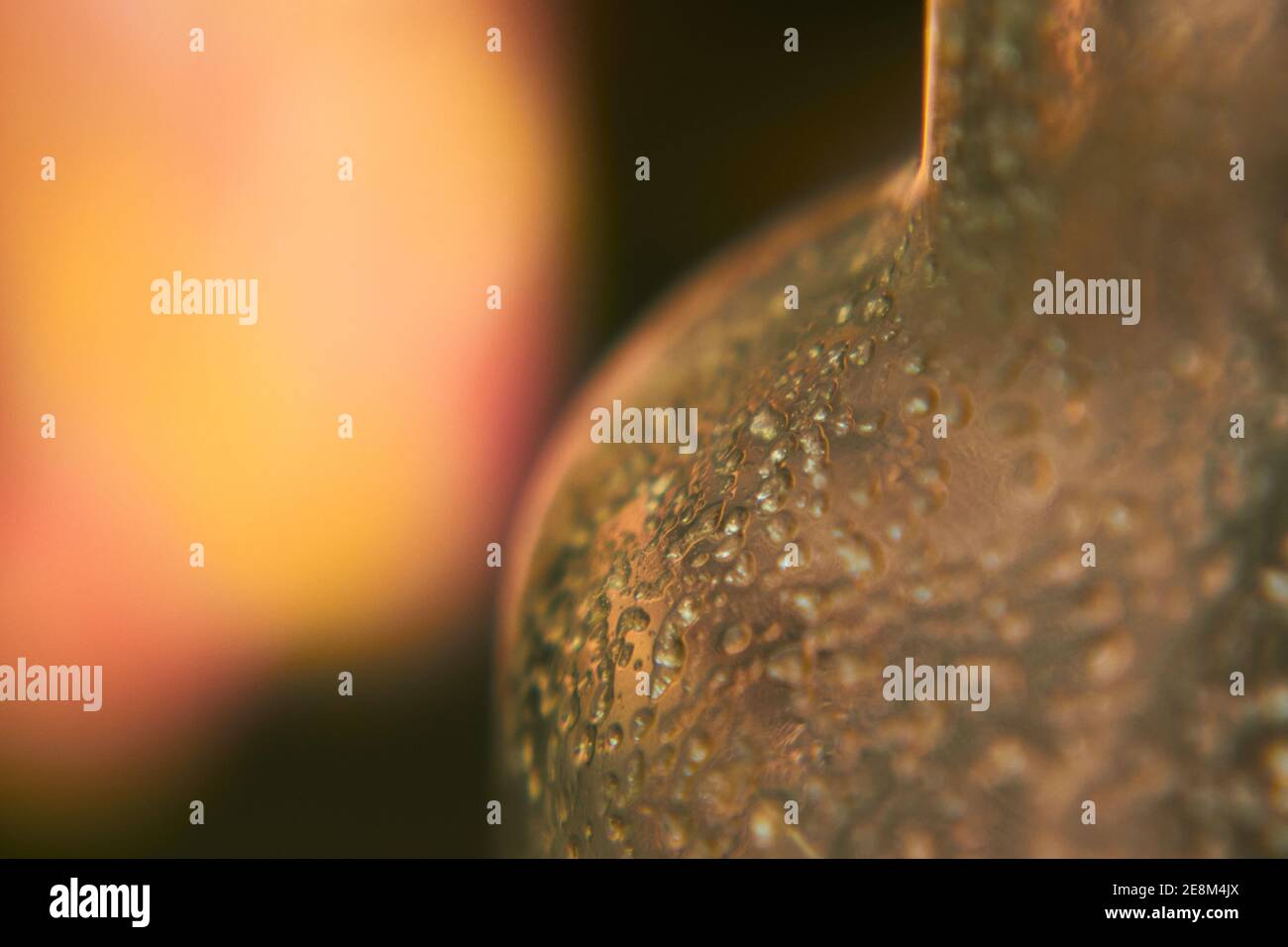 A closeup of the waterdrops on the surface of the glass filled with ...