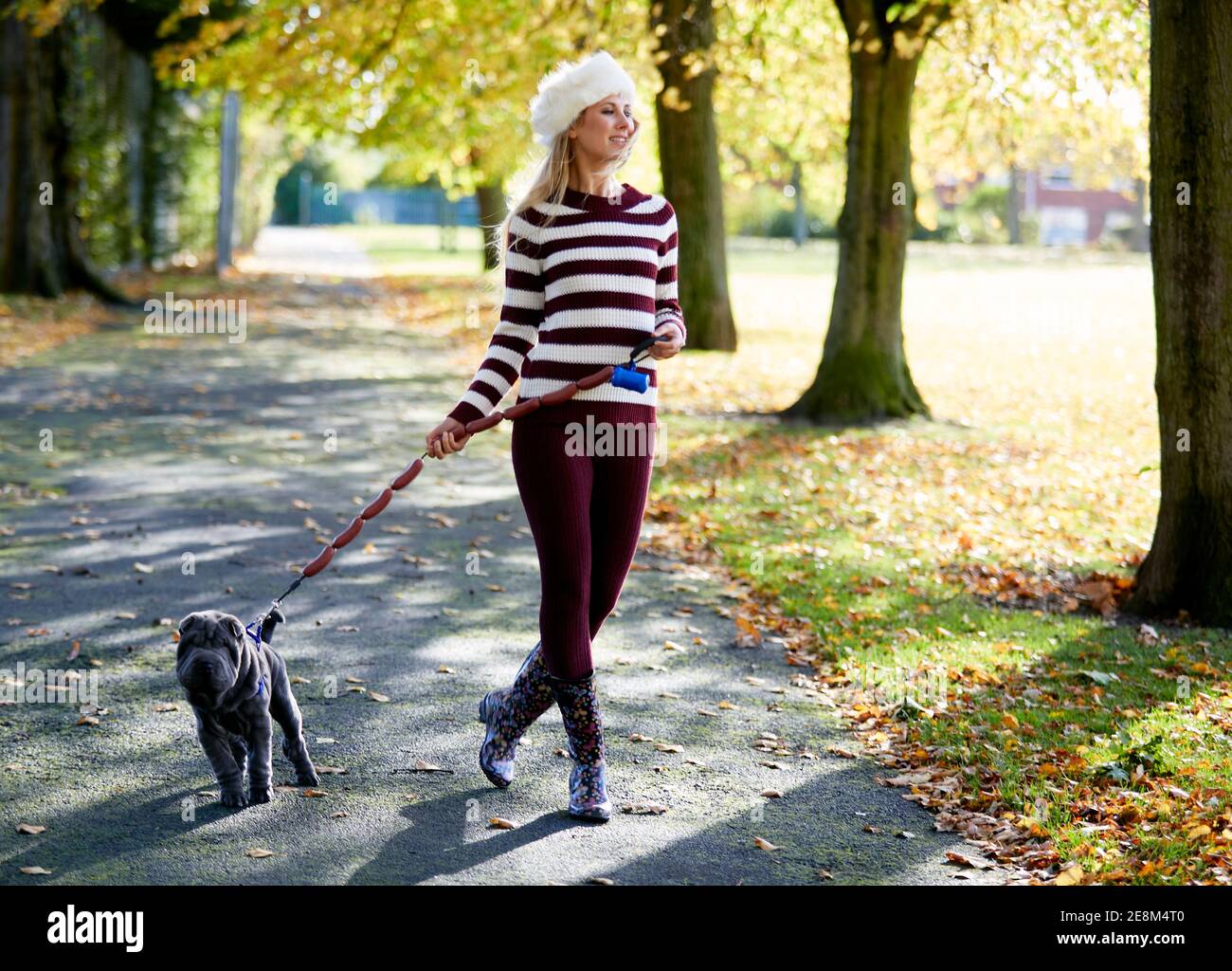 Beautiful blonde walking in park hi-res stock photography and images ...