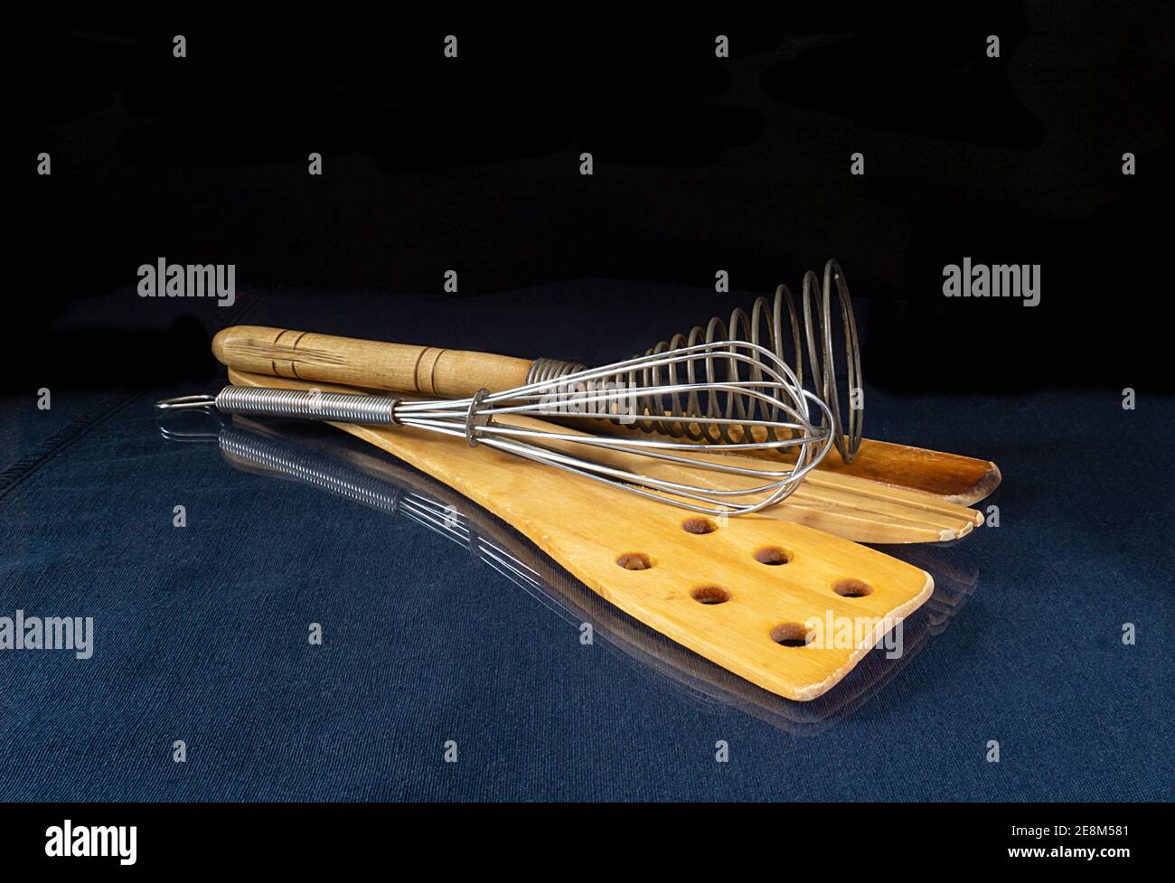 The Kitchen instruments are from tree to rest upon glass table with ...