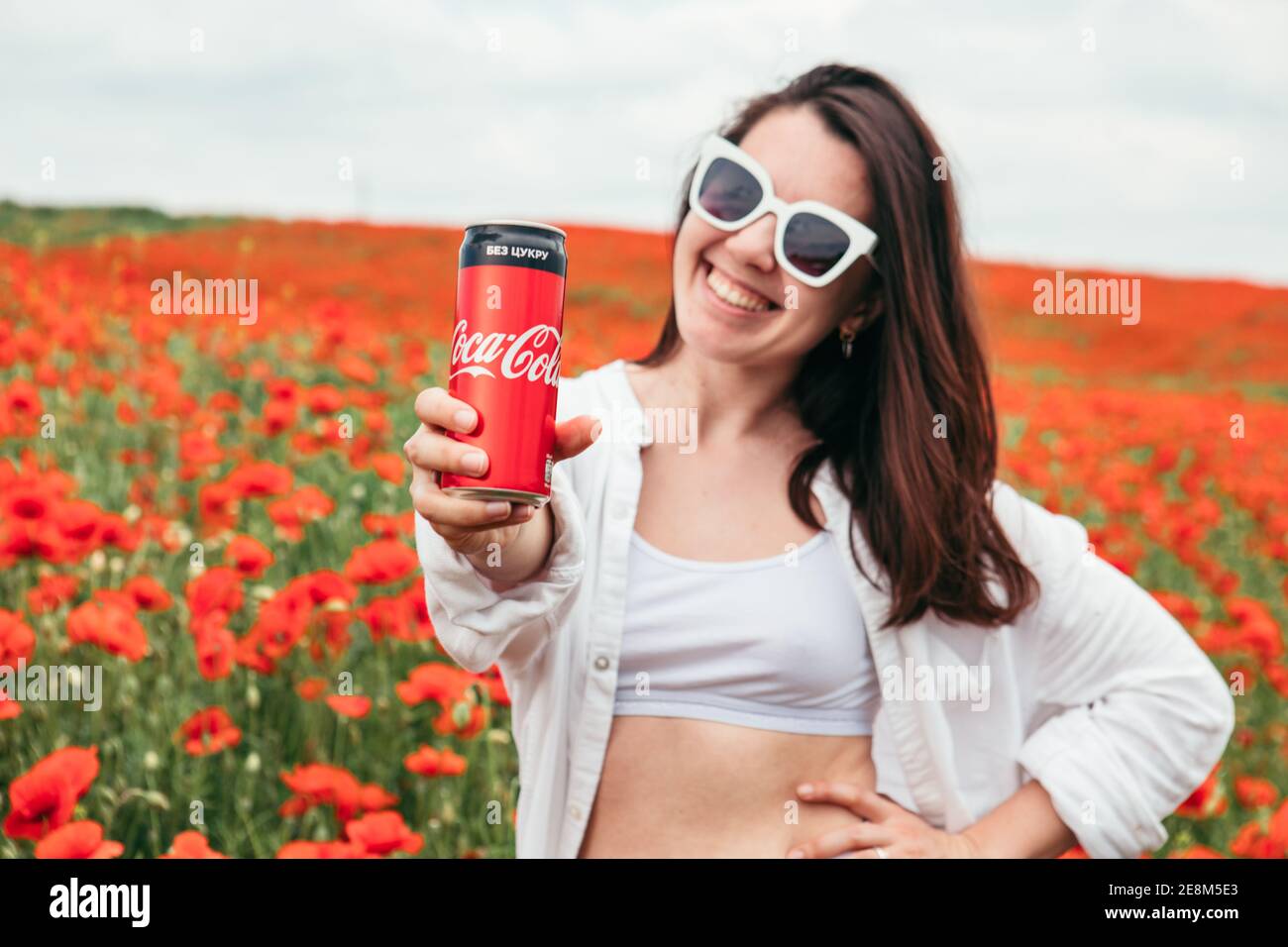 Coca cola woman drinking bottle hi-res stock photography and images - Alamy