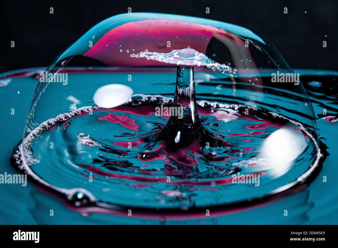 High resolution macro photograph of a colorful water drop splashing ...