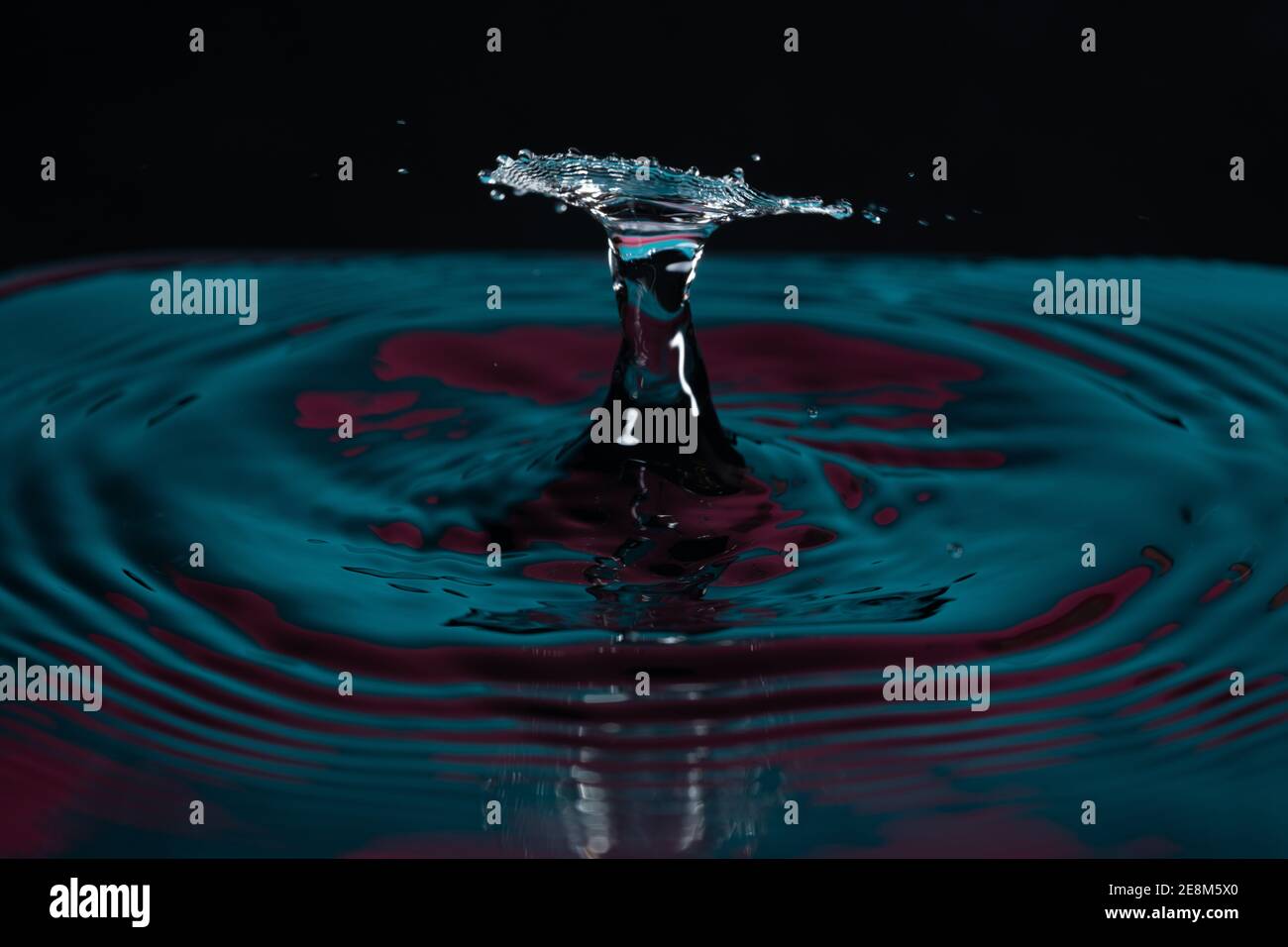 High resolution macro photograph of a colorful water drop splashing ...