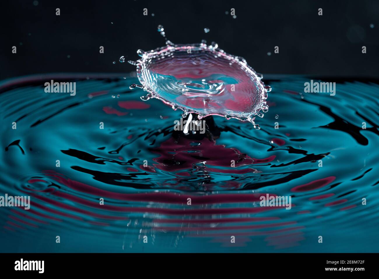 High resolution macro photograph of a colorful water drop splashing ...