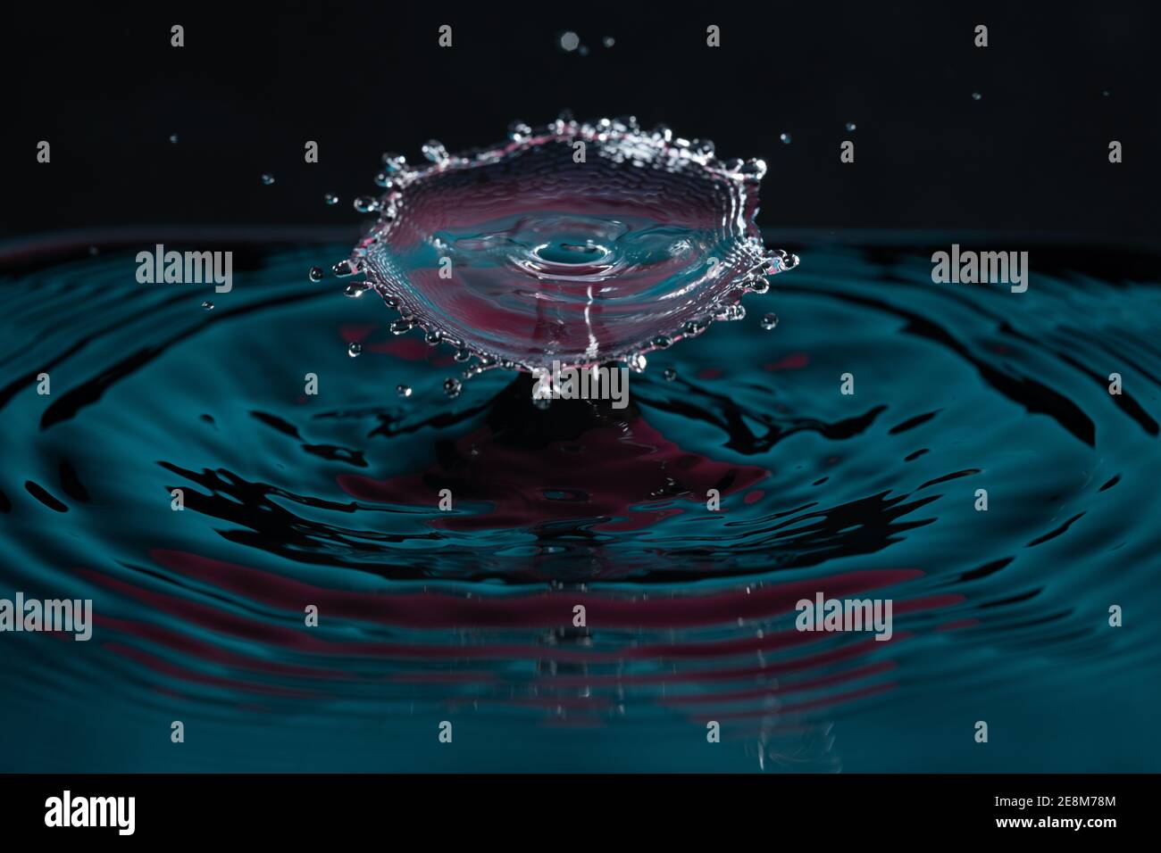 High resolution macro photograph of a colorful water drop splashing ...