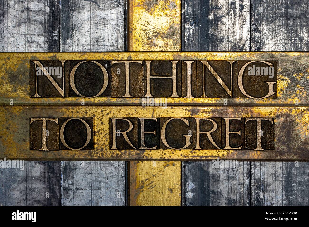 Nothing to Regret text on vintage textured grunge copper and gold ...