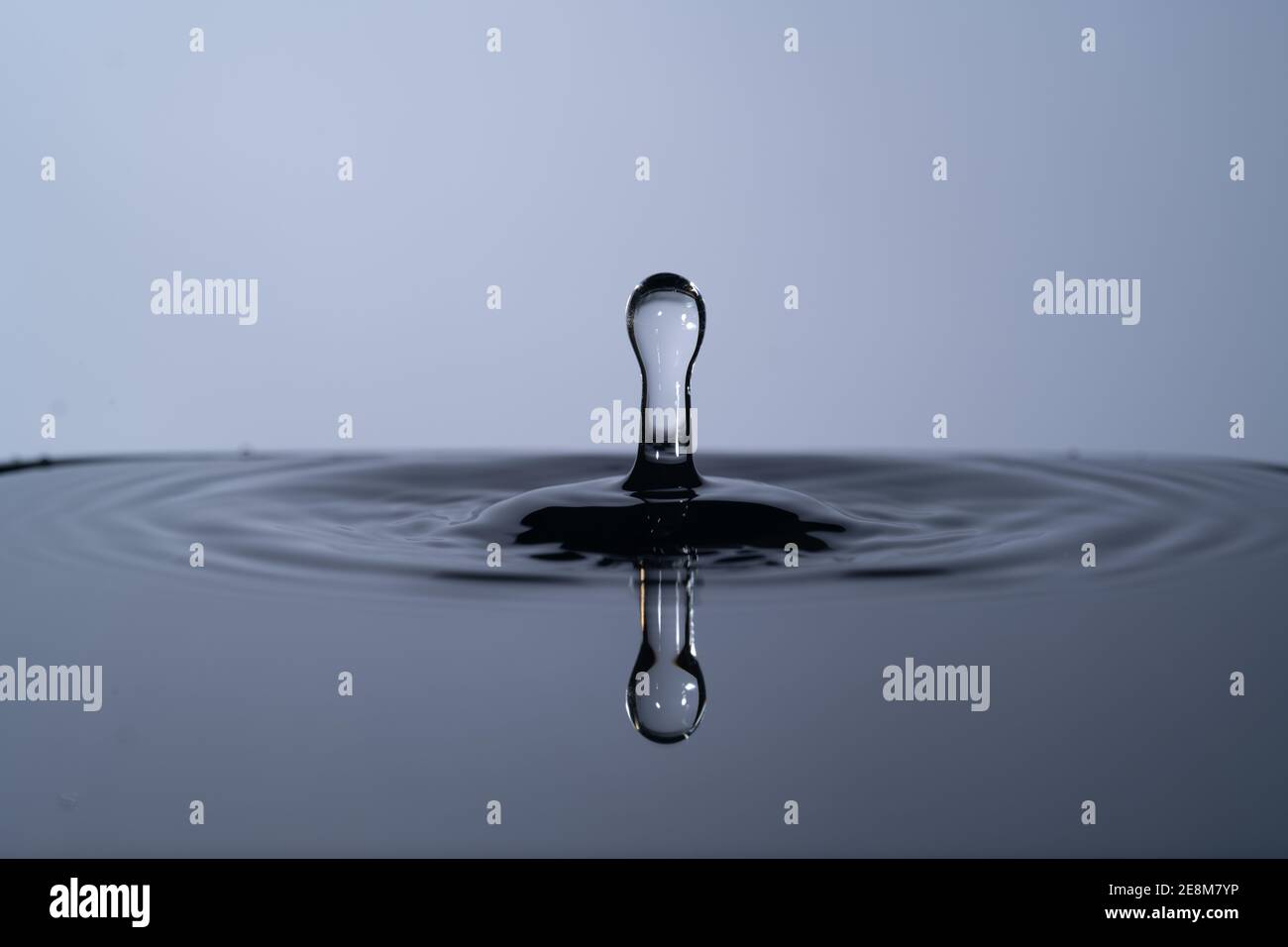 High resolution macro photograph of a colorful water drop splashing ...