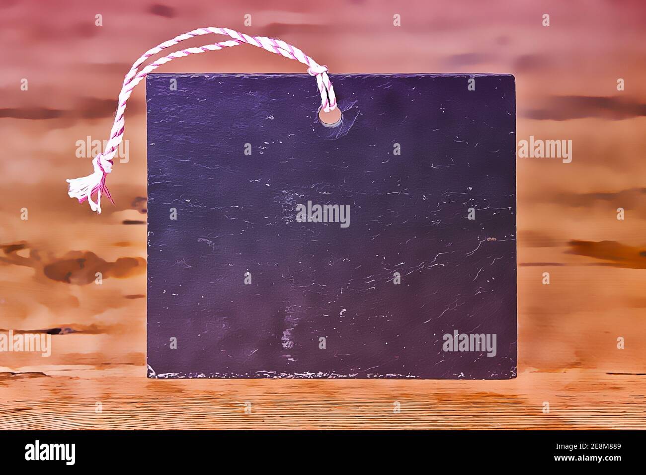 black chalk board standing on wooden table. illustration painting ...