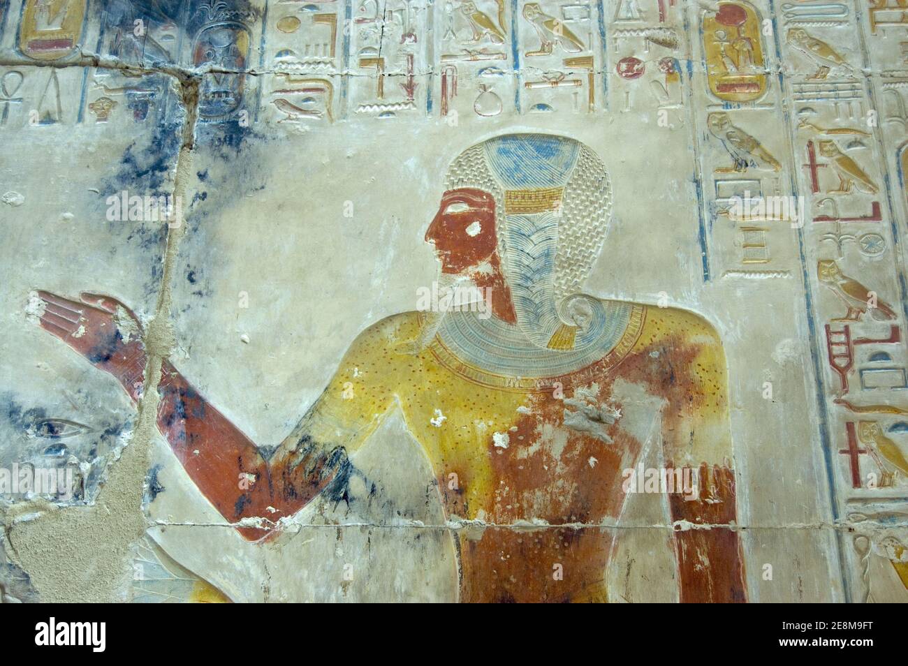 Ancient Egyptian bas relief of the Pharaoh Seti I wearing the leopard ...