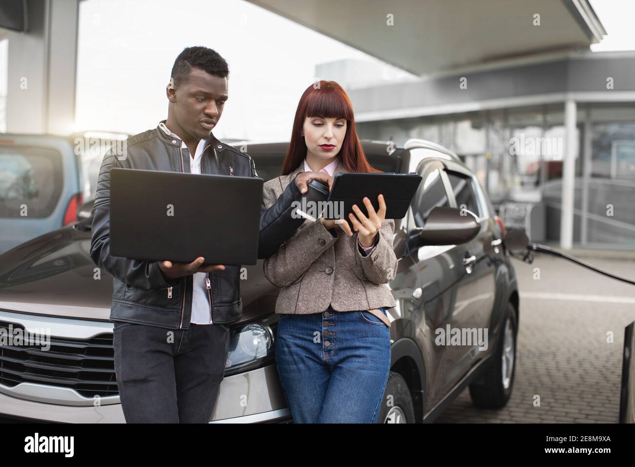 Front view of multiracial male and female friends in casual outfits ...