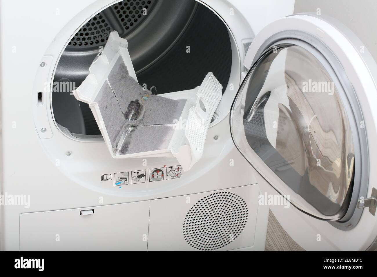 Dirty filter from clothes dryer Stock Photo - Alamy