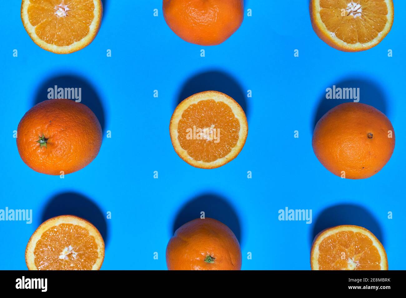 Whole and split oranges on a blue background. CITRUS CITRIC Stock Photo ...