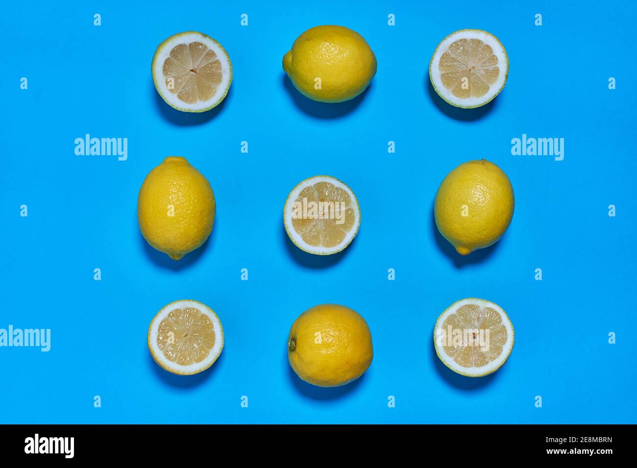 Whole and split lemons on a blue background. CITRUS CITRIC Stock Photo ...
