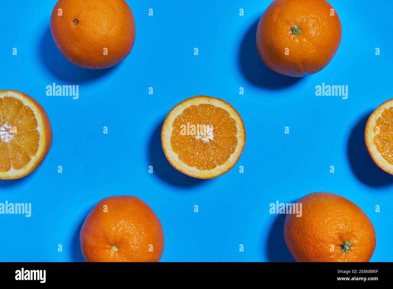 Whole and split oranges on a blue background. CITRUS CITRIC Stock Photo ...