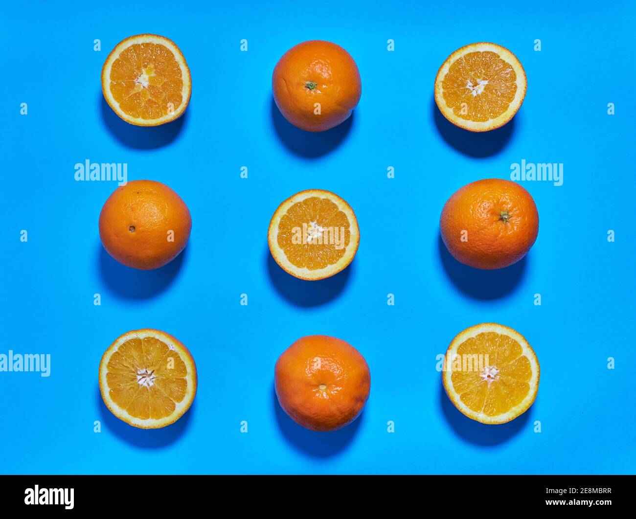 Whole and split oranges on a blue background. CITRUS CITRIC Stock Photo ...