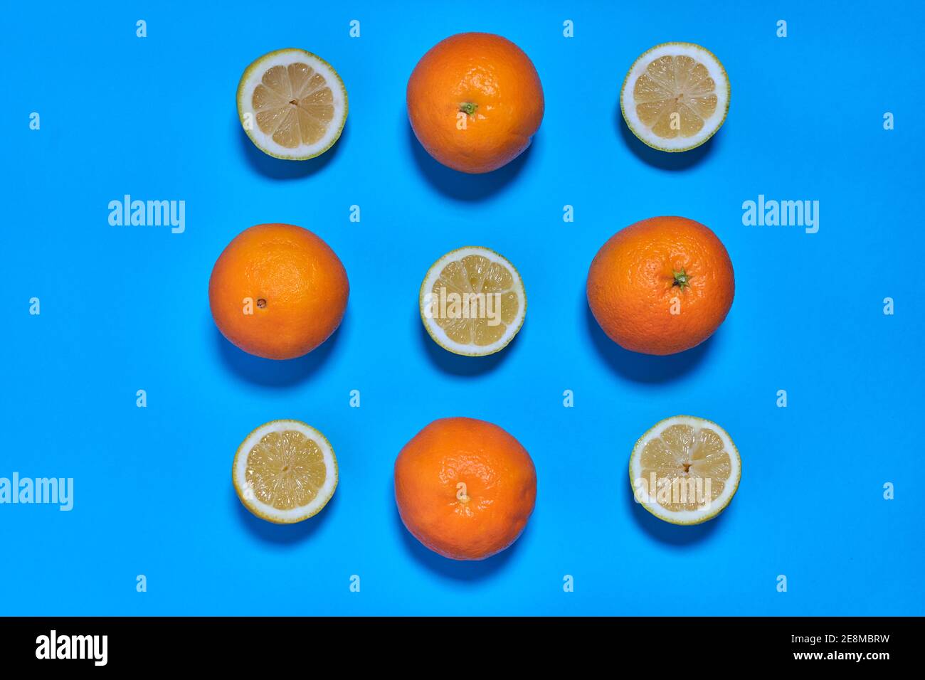 Whole and split oranges on a blue background. CITRUS CITRIC Stock Photo ...