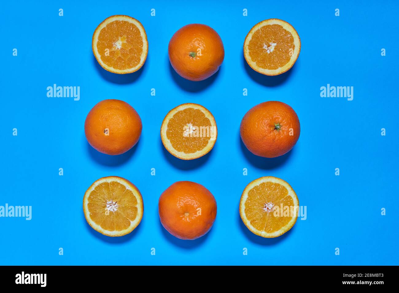 Whole and split oranges on a blue background. CITRUS CITRIC Stock Photo ...