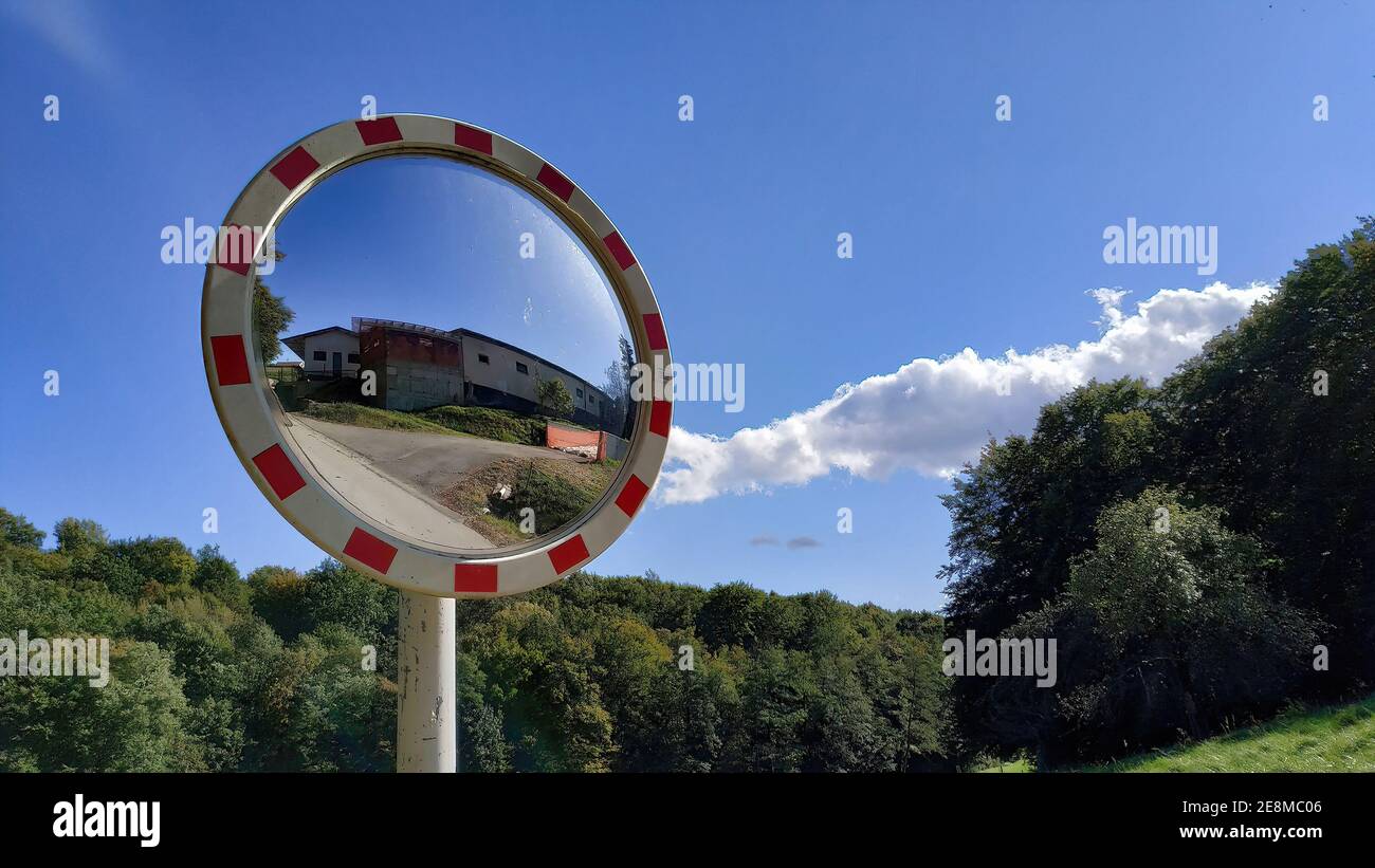 A beautiful view of rural houses reflecting in the road mirror Stock ...