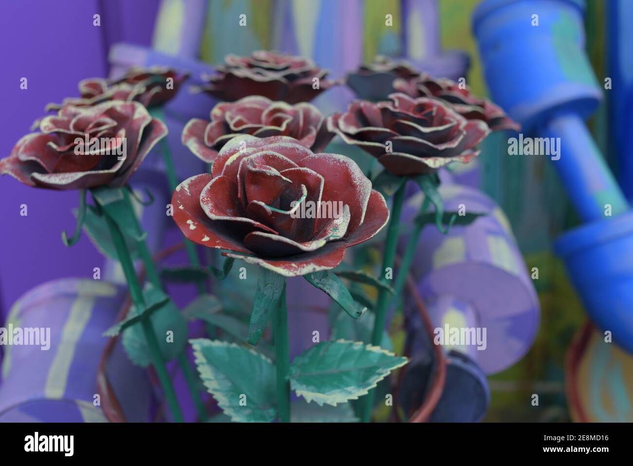 Metal rose. Roses made of artificial material. Painted metal flowers ...