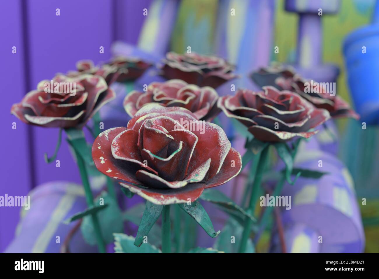 Metal rose. Roses made of artificial material. Painted metal flowers ...