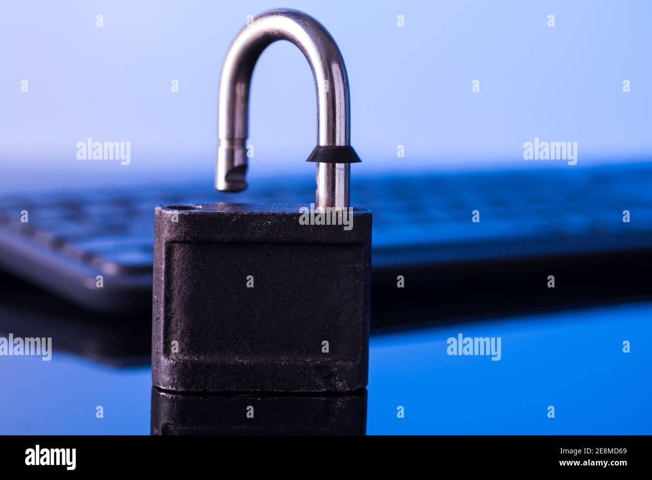Locking the computer keyboard. The lock and keypad are tinted blue ...