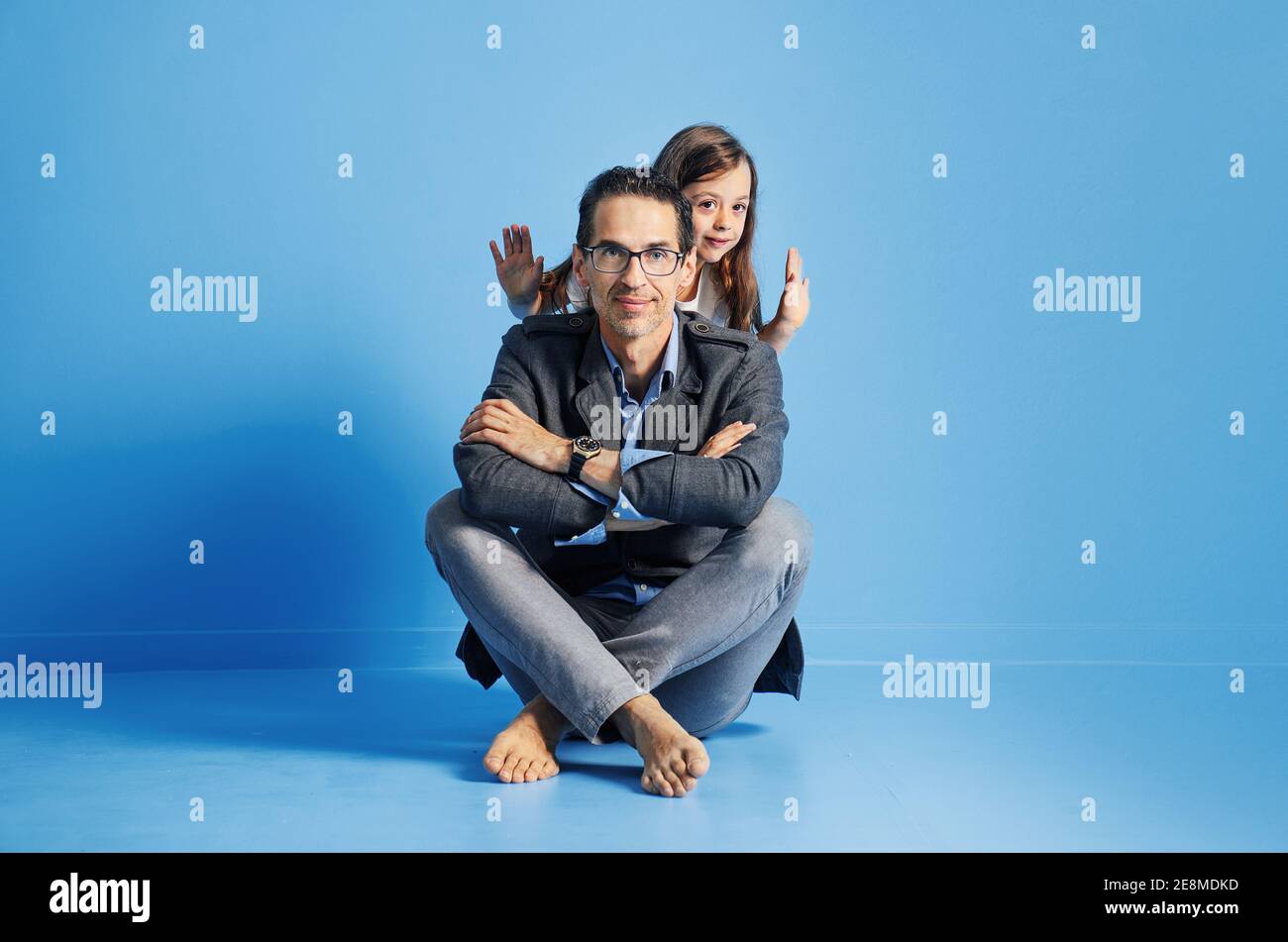 Portrait of a father posing with a cute, little daughter Stock Photo ...