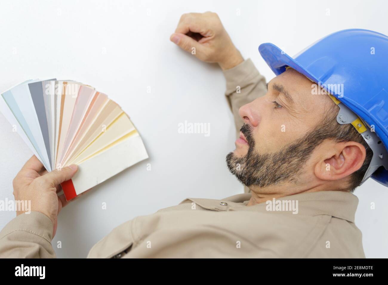 painter man with color swatches in your hand Stock Photo - Alamy