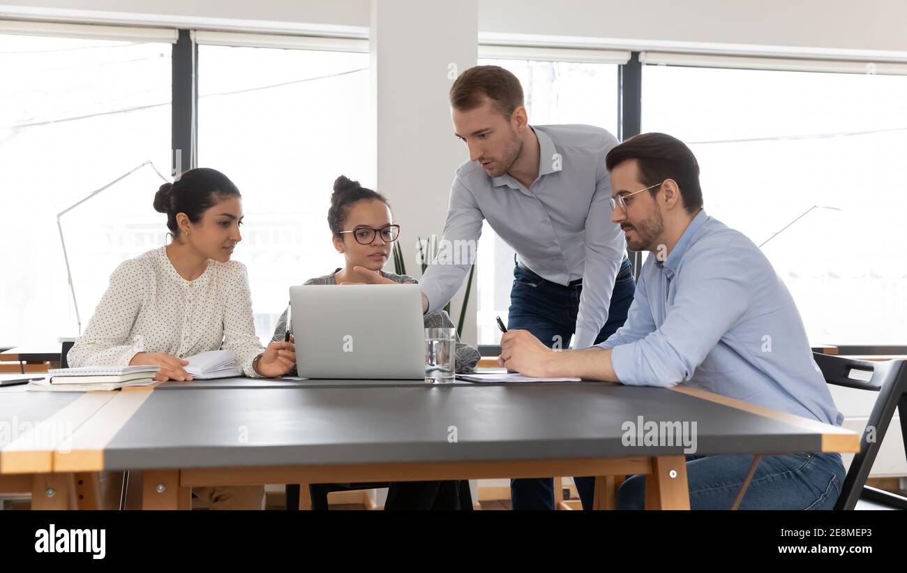 Project manager showing online presentation to colleagues Stock Photo ...