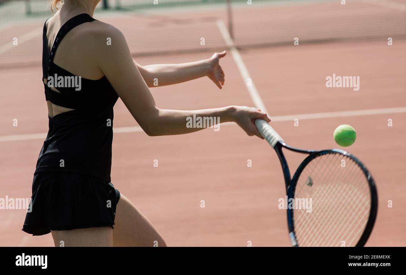 Tennis balls and rocket on court field in sunny day, sport, hobby Stock ...