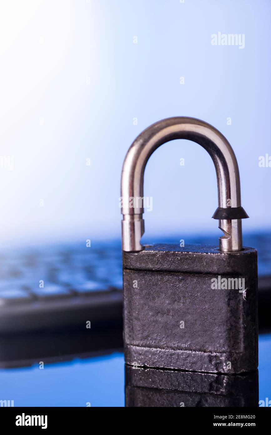 Locking the computer keyboard. The lock and keypad are tinted blue ...