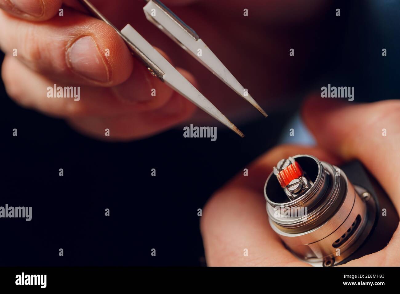 Specialist replaces spring for smoking vape.Professional maintaining ...