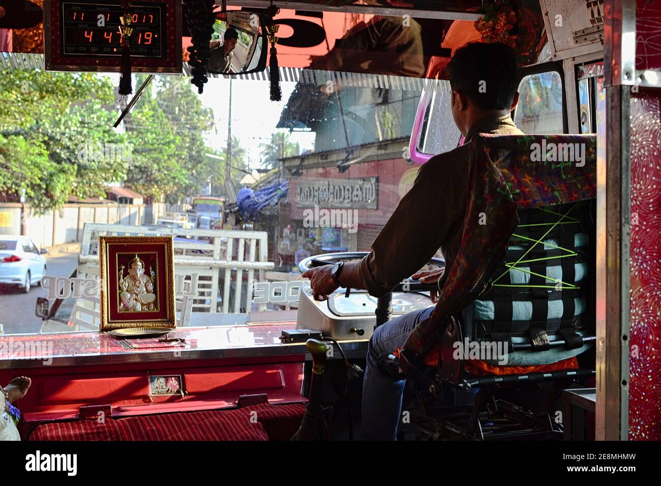 Thalissery, Kerala, India - January, 2017: Driver in bus decorated with ...