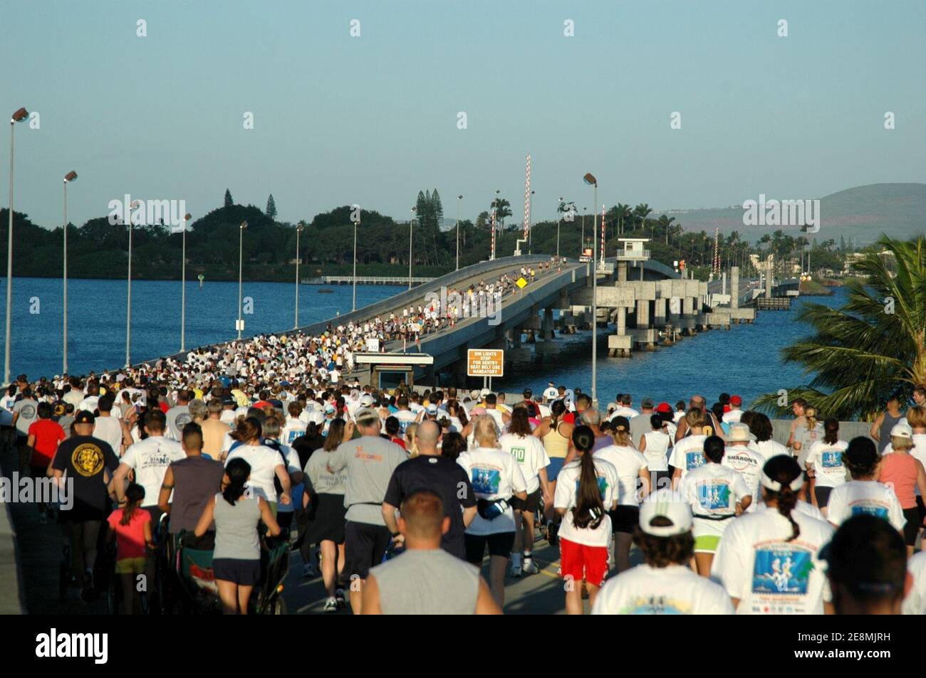 Military and civilian runners crossing the Admiral Clarey Bridge during ...