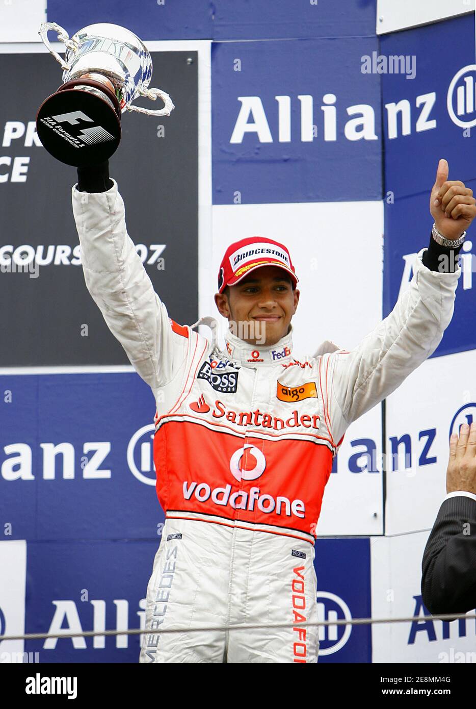 British McLaren Mercedes driver Lewis Hamilton celebrates his third ...