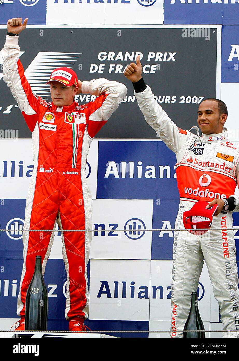 Finnish Formula One driver Kimi Raikkonen (top) of Ferrari celebrates ...