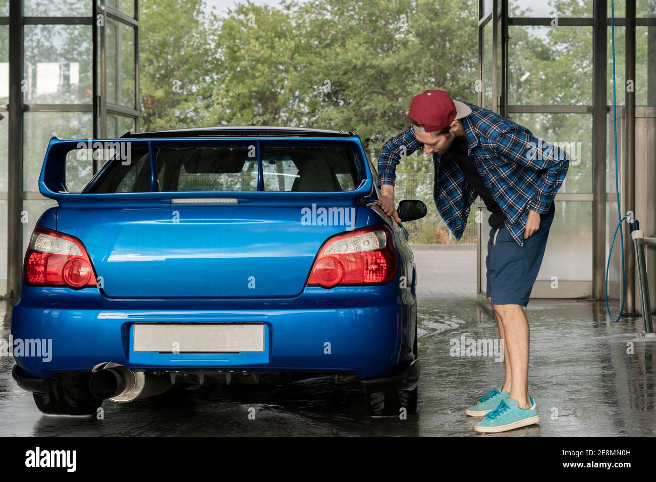 male driver cleaning the car inside the self wash station box Stock ...