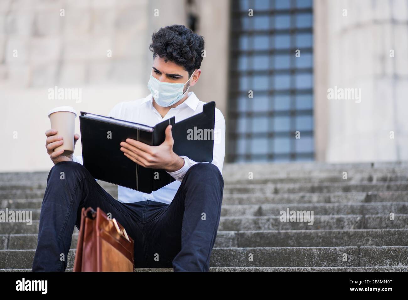 Successful man reading documents work hi-res stock photography and ...