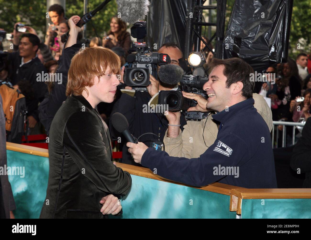 Cast member Rupert Grint speaks to the media as he arrives to the ...